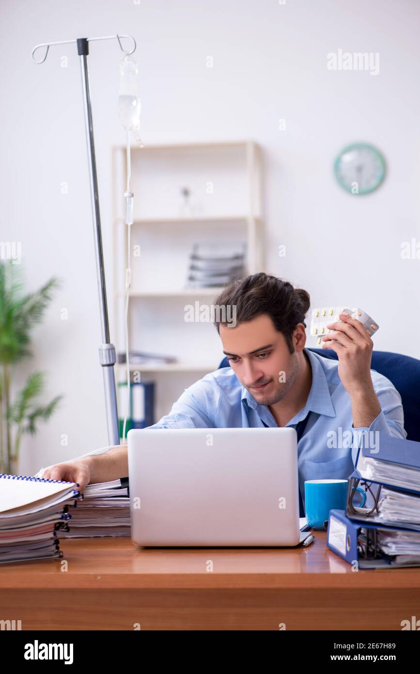 Male employee suffering at workplace Stock Photo - Alamy