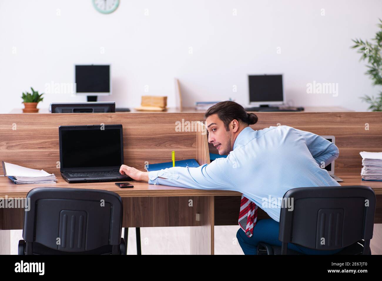 Male employee in industrial espionage concept Stock Photo - Alamy