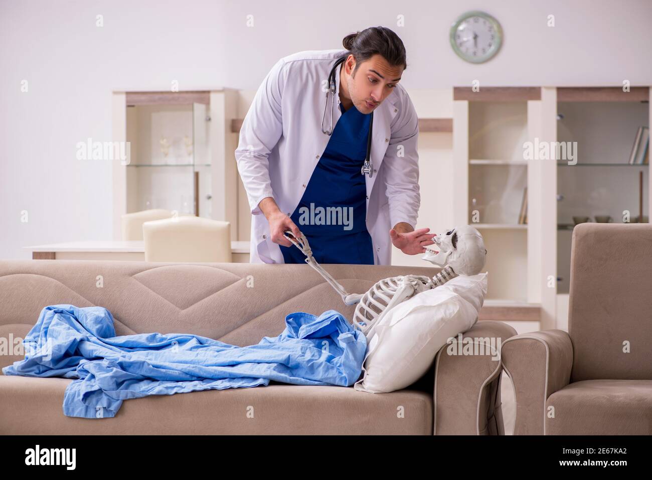 Male paramedic visiting skeleton patient Stock Photo - Alamy