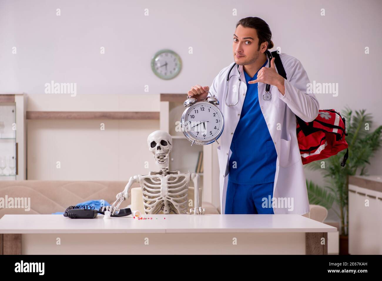 Male paramedic visiting skeleton patient Stock Photo - Alamy