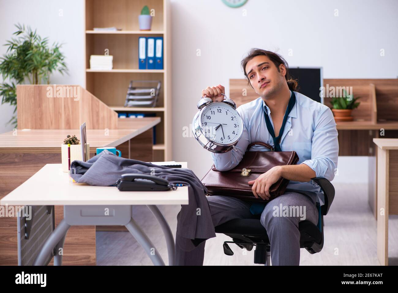 Male employee being late for his job Stock Photo - Alamy