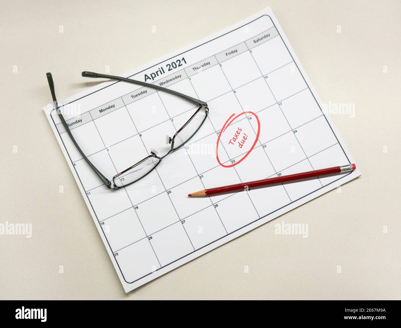 Calendar with the date of the 15th filled with the words Taxes Due ...