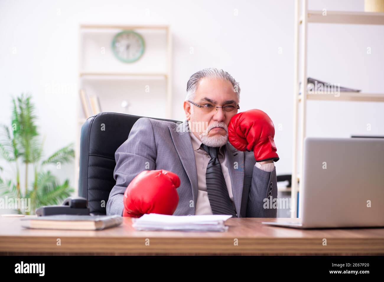 Businessman angry and furious at his workplace Stock Photo - Alamy