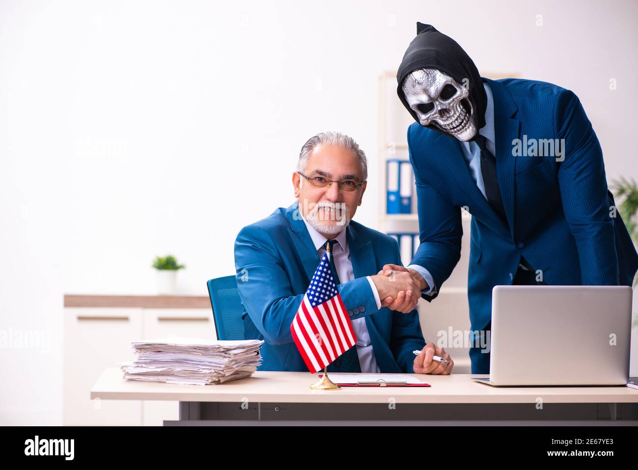 Old businessman employee making deal with the devil Stock Photo - Alamy