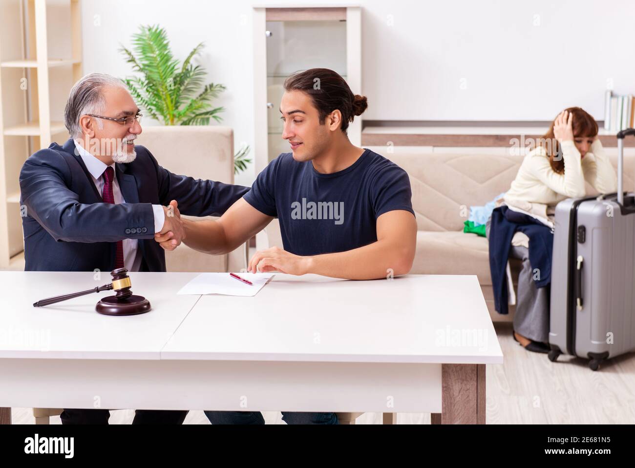 Old judge and young couple in divorcing concept Stock Photo - Alamy