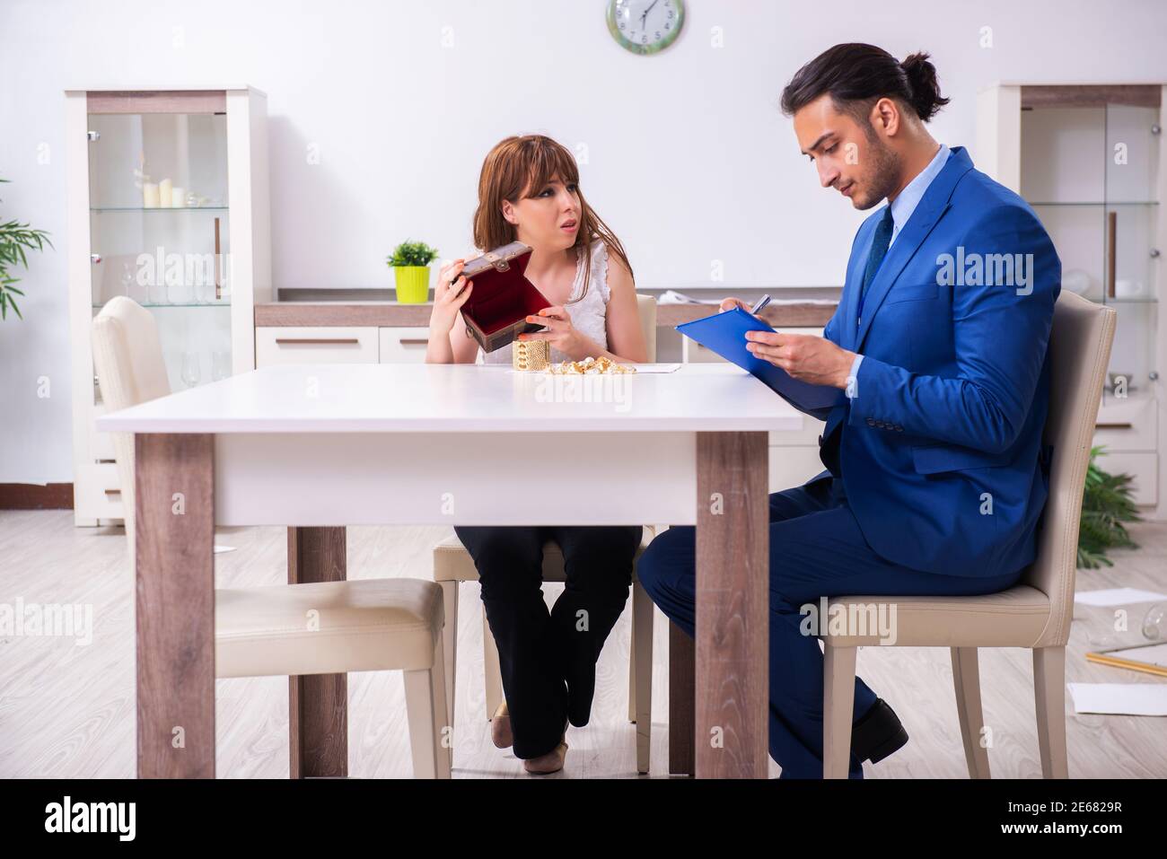 Female owner and police officer in housebreaking concept Stock Photo ...