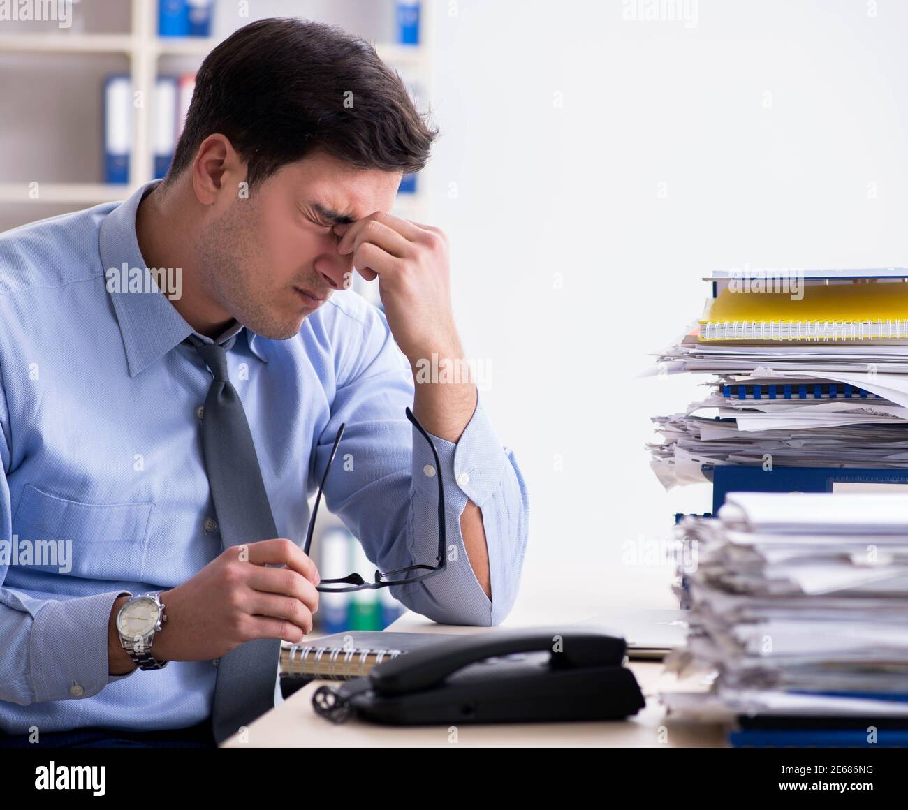 The extremely busy businessman working in office Stock Photo - Alamy