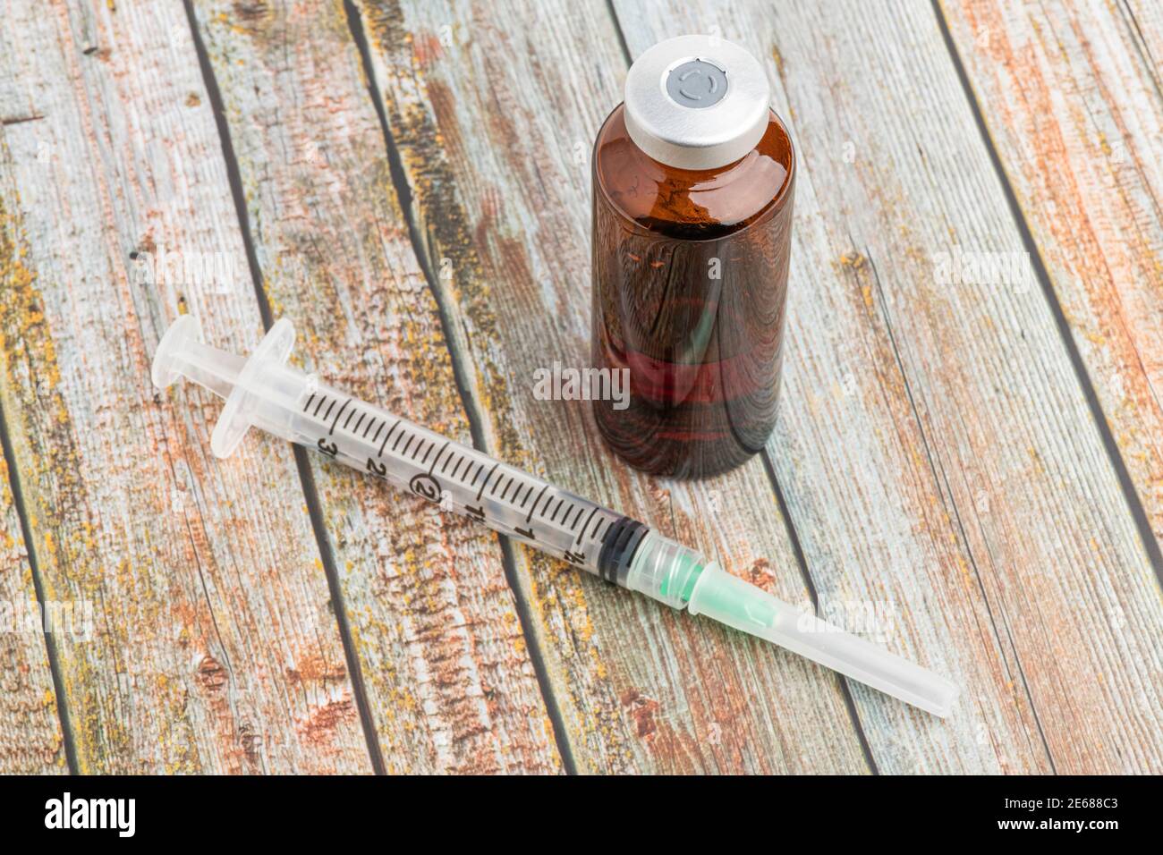 A close-up shot of a hygienic single-use plastic disposable syringe ...