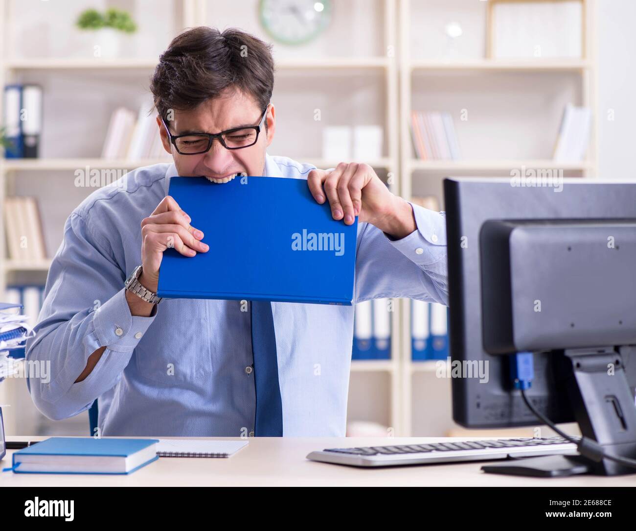 The tired businessman with too much paperwork Stock Photo - Alamy
