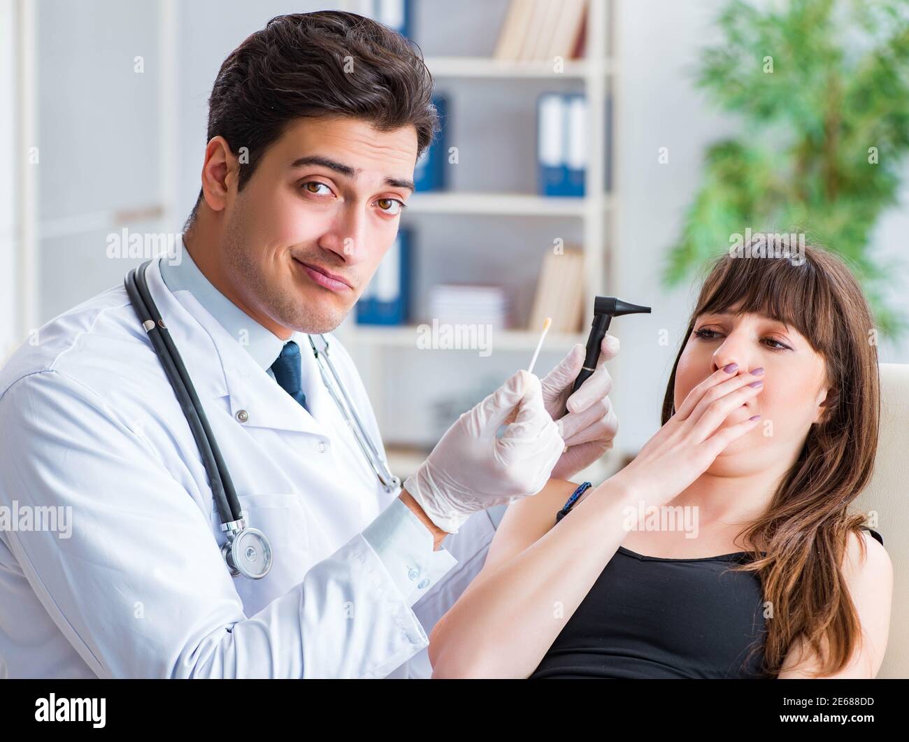The doctor checking patients ear during medical examination Stock Photo ...