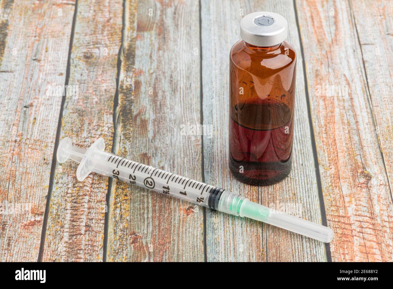 A close-up shot of a hygienic single-use plastic disposable syringe ...