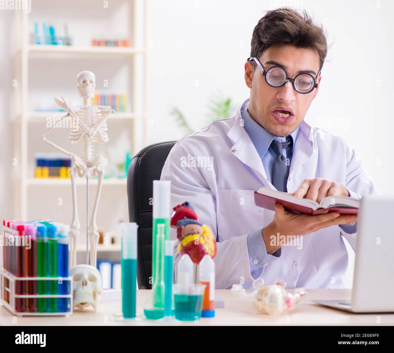 The funny doctor having fun in hospital lab Stock Photo - Alamy