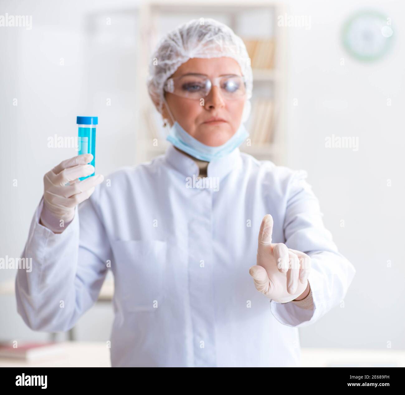 The woman chemist pressing virtual button in lab Stock Photo - Alamy