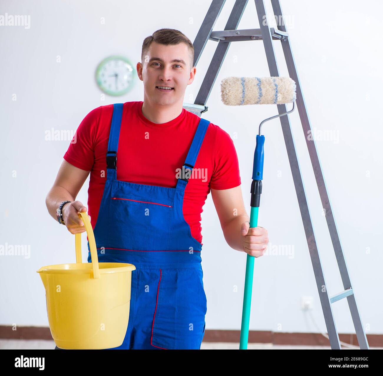 The male painter preparing for painting job at construction site Stock ...