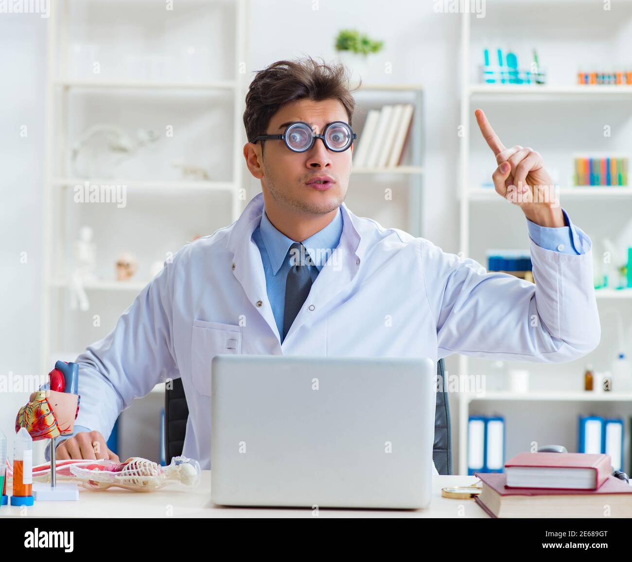 The funny doctor having fun in hospital lab Stock Photo - Alamy