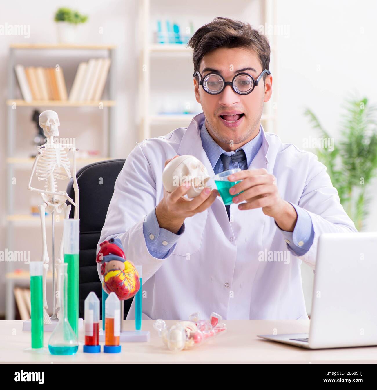 The funny doctor having fun in hospital lab Stock Photo - Alamy