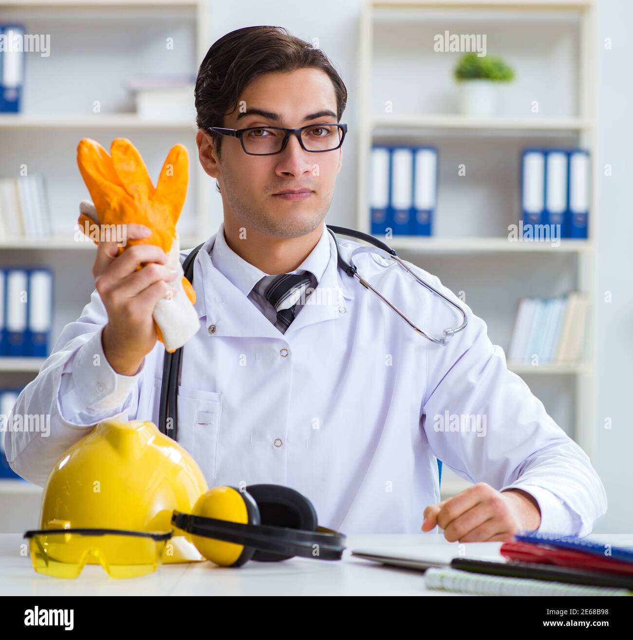 The safety doctor advising about wearing protective gloves Stock Photo ...