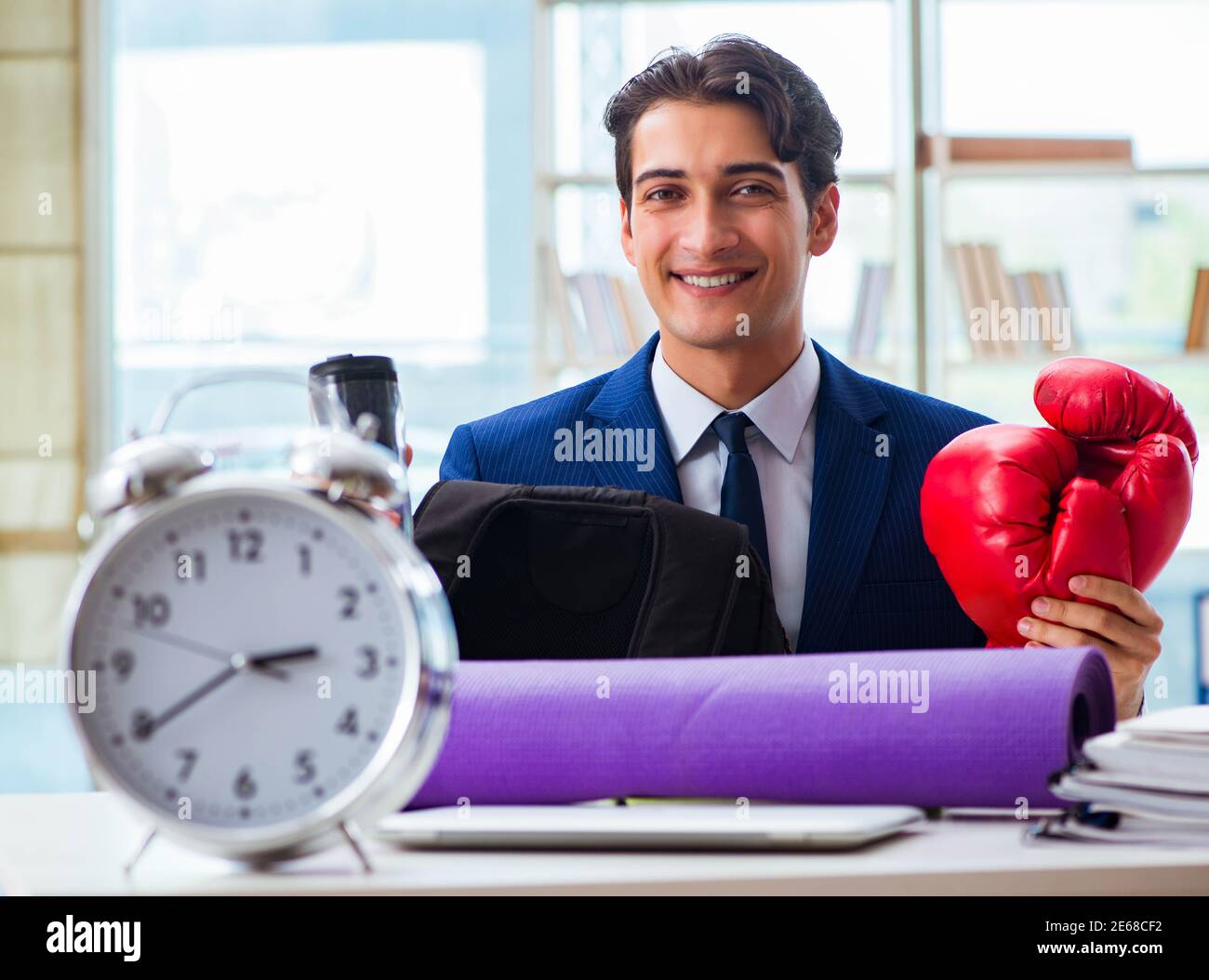 The man with boxing gloves in the office Stock Photo - Alamy