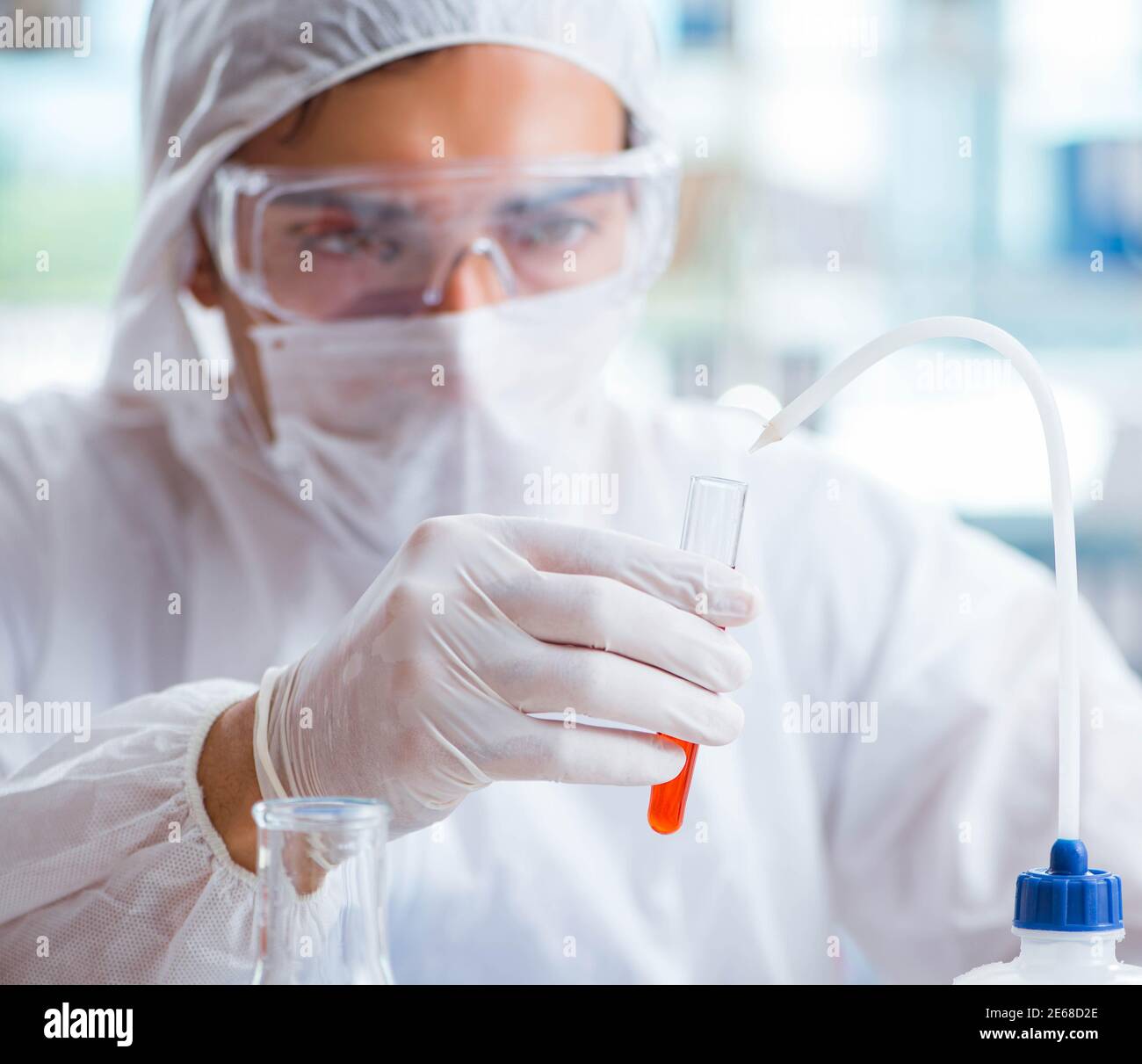 The chemist working in the laboratory with hazardous chemicals Stock ...