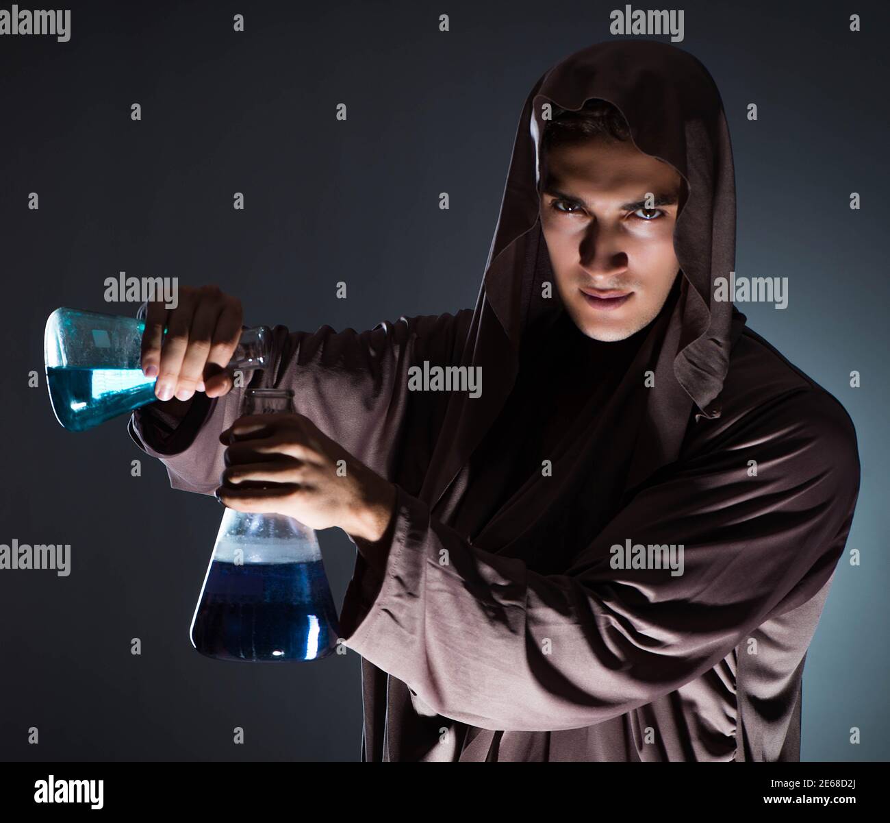 The alchemist doing experiments in alchemy concept Stock Photo - Alamy