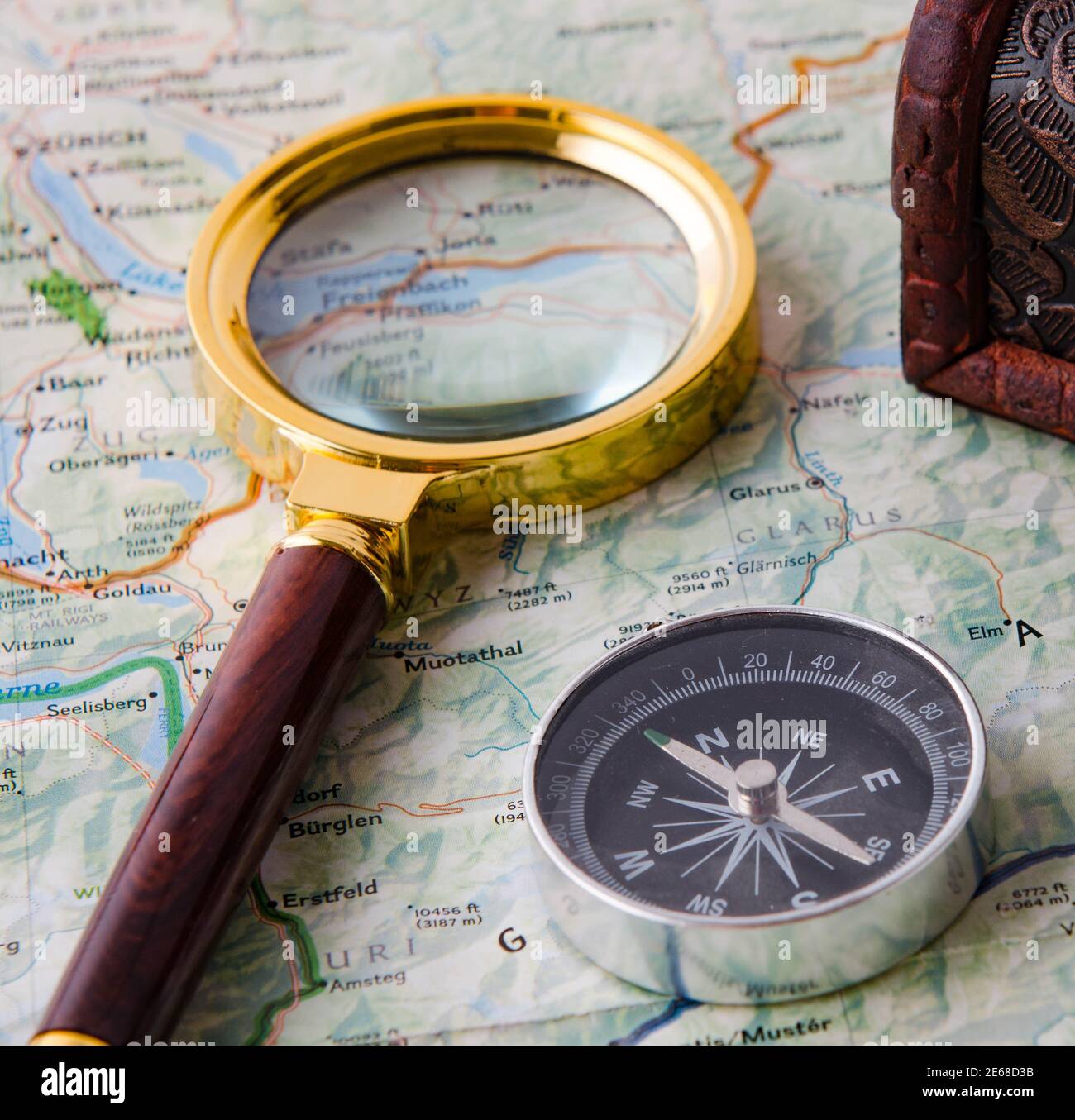 The travel concept with compass and map Stock Photo - Alamy