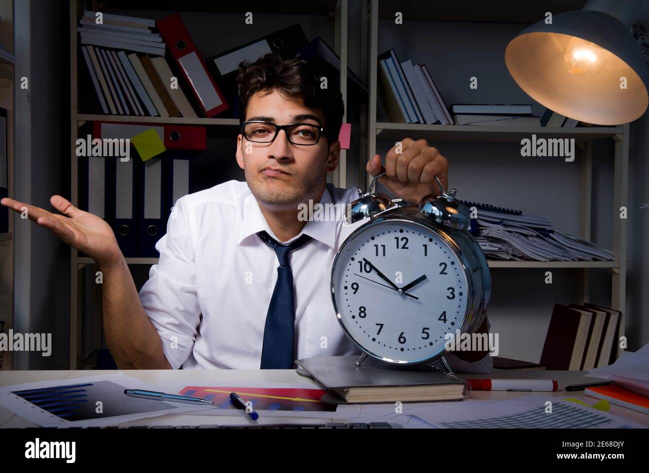 The man businessman working late hours in the office Stock Photo - Alamy