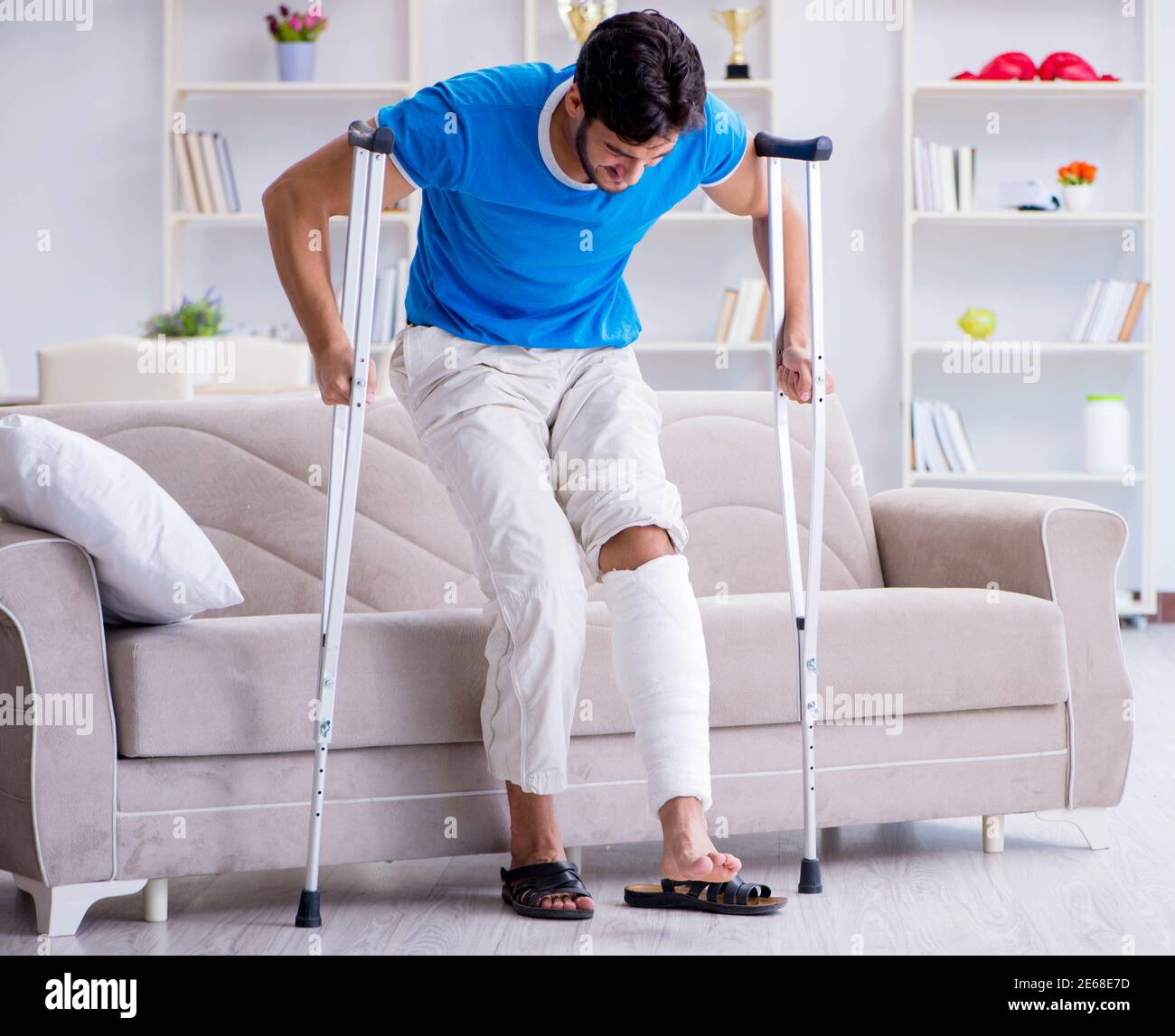The injured young man recovering at home Stock Photo - Alamy