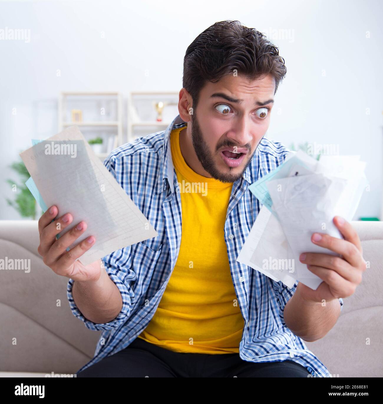 The man angry at bills he needs to pay Stock Photo - Alamy