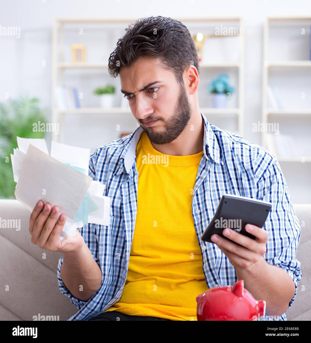 The man angry at bills he needs to pay Stock Photo - Alamy