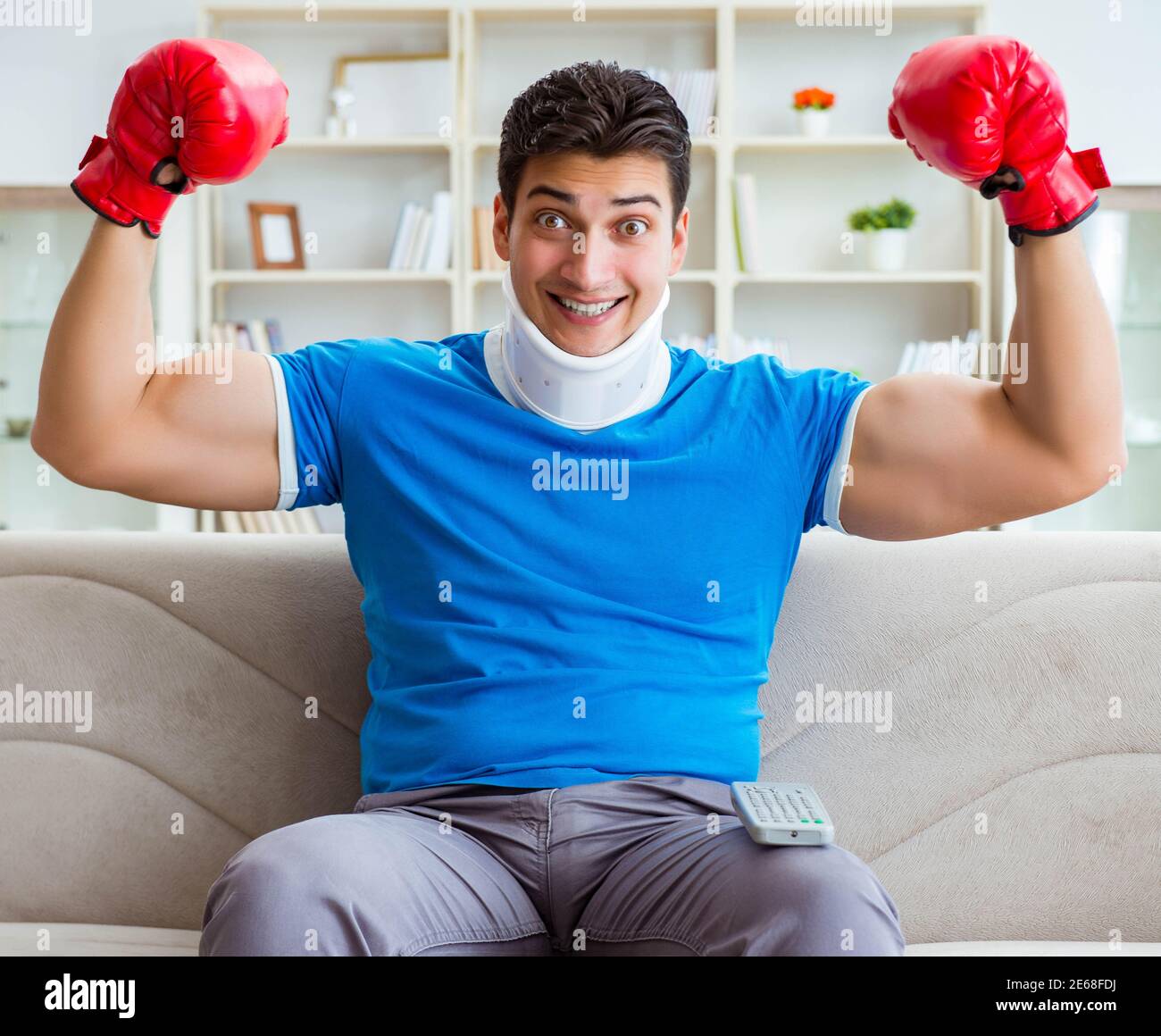 The man with neck injury watching boxing at home Stock Photo - Alamy