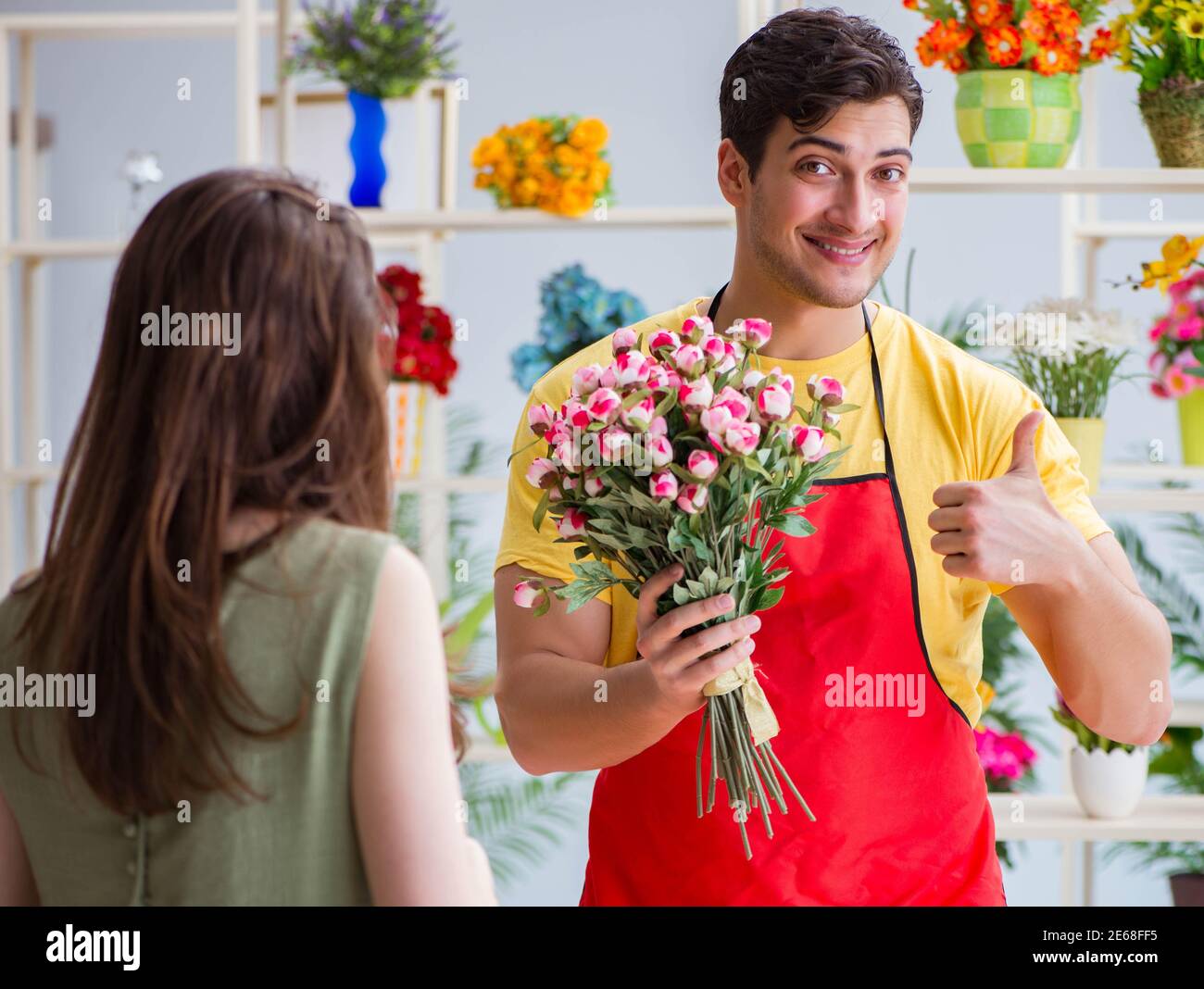 The florist selling flowers in a flower shop Stock Photo - Alamy