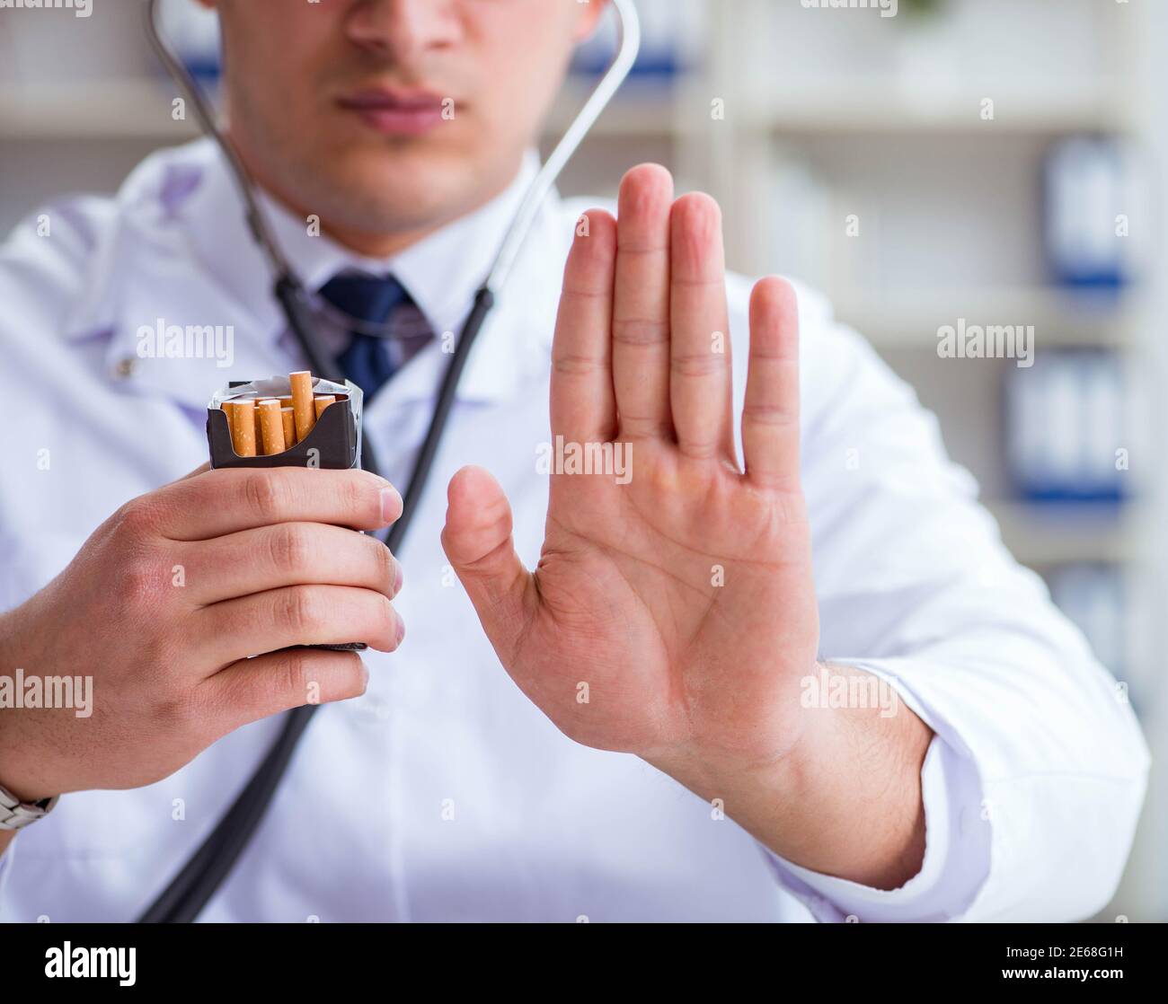The male doctor in anti-smoking conceptwithcigarette pack Stock Photo ...