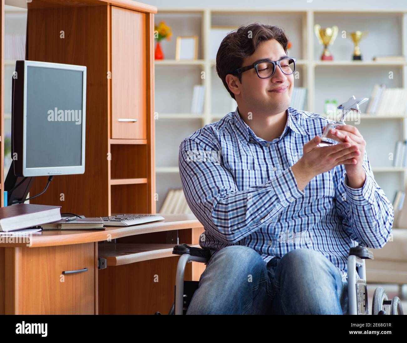 The disabled student studying at home on wheelchair Stock Photo - Alamy
