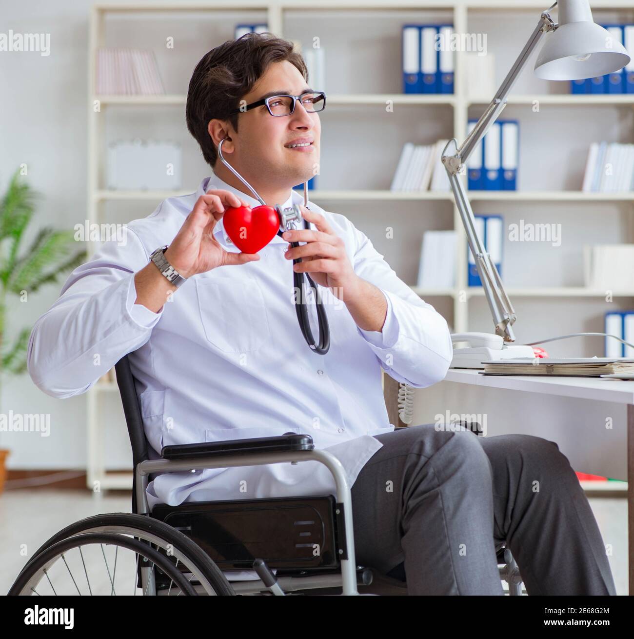 The disabled doctor on wheelchair working in hospital Stock Photo - Alamy