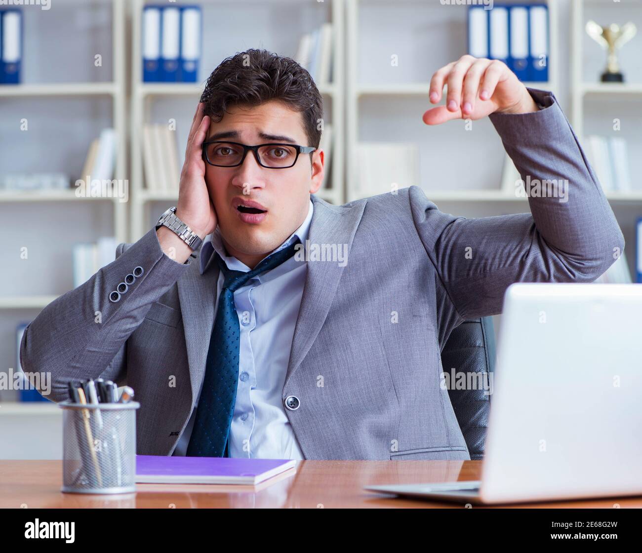 Businessman sweating excessively smelling bad in office at workplace ...