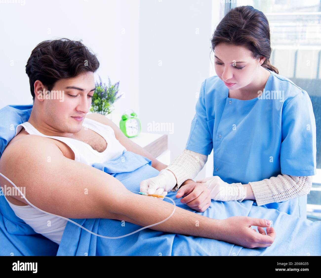 The doctor doing medical injection in hospital room Stock Photo - Alamy