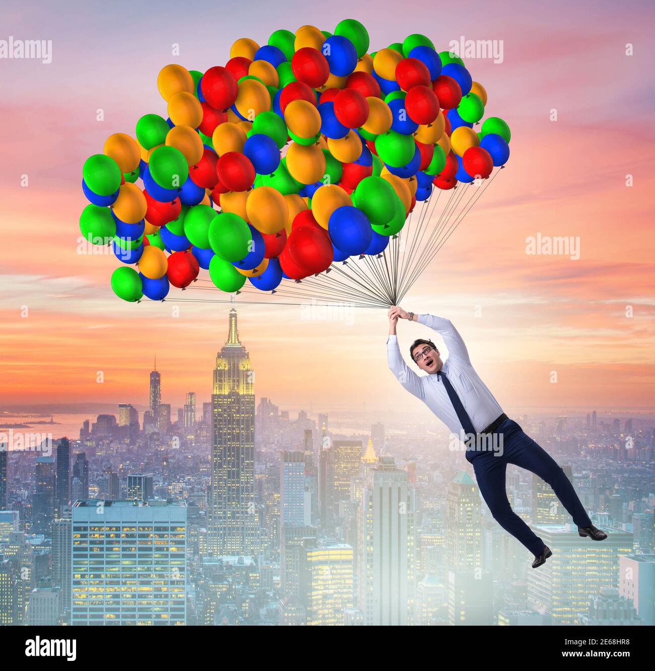 The businessman flying on balloons in challenge concept Stock Photo - Alamy