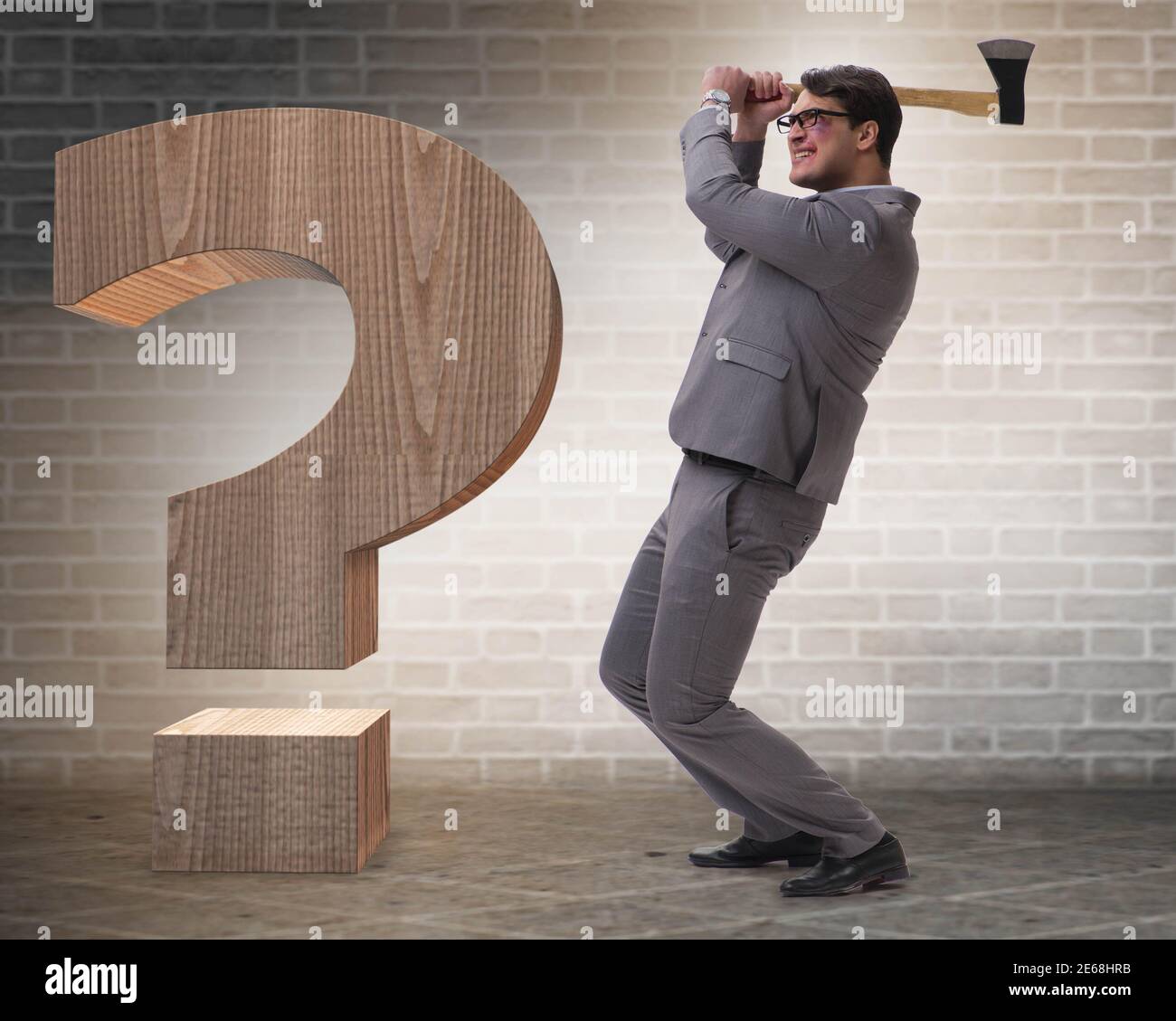 The angry man with axe axing the question mark Stock Photo - Alamy