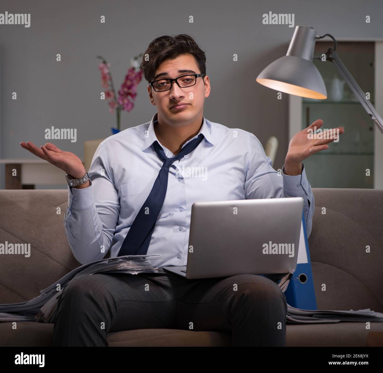 The businessman workaholic working late at home Stock Photo - Alamy