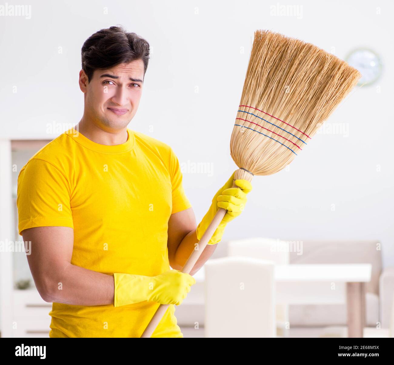 The man husband cleaning the house helping his wife Stock Photo - Alamy