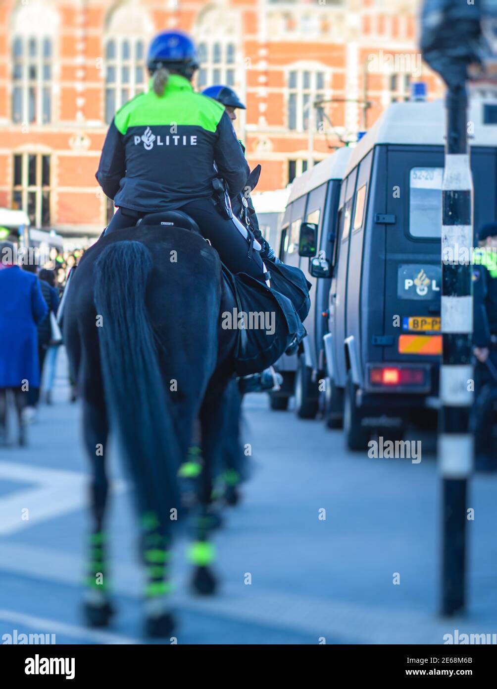 Dutch police squad formation and horseback riding mounted police back ...