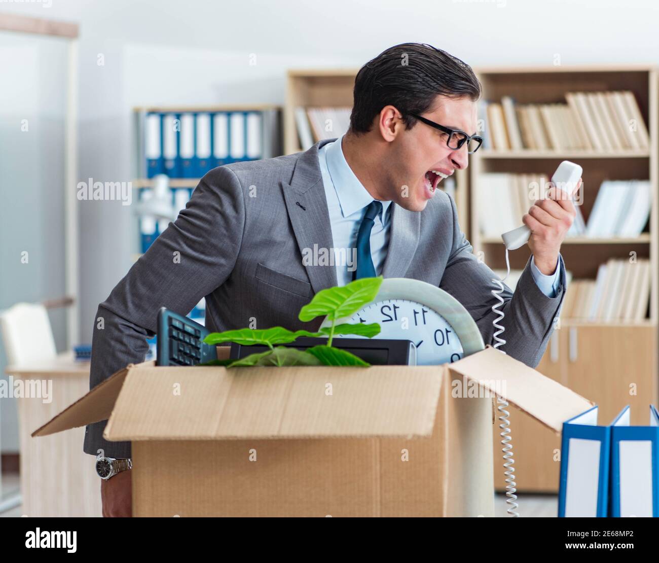 The man moving office with box and his belongings Stock Photo - Alamy