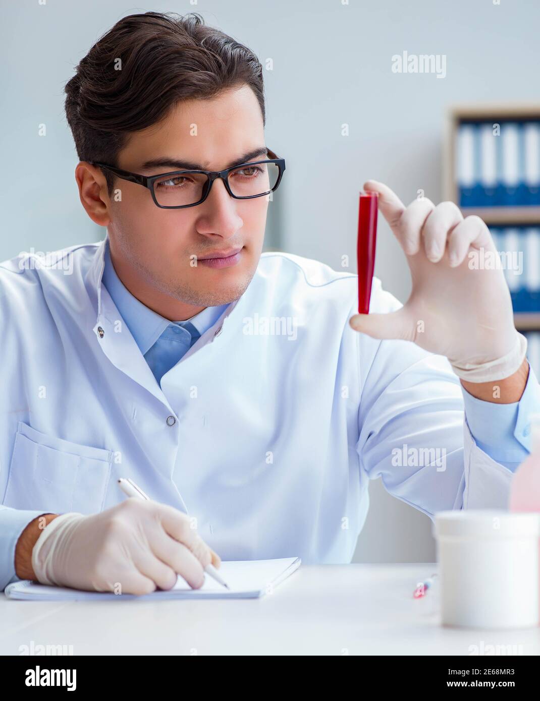 The doctor working with blood samples Stock Photo - Alamy