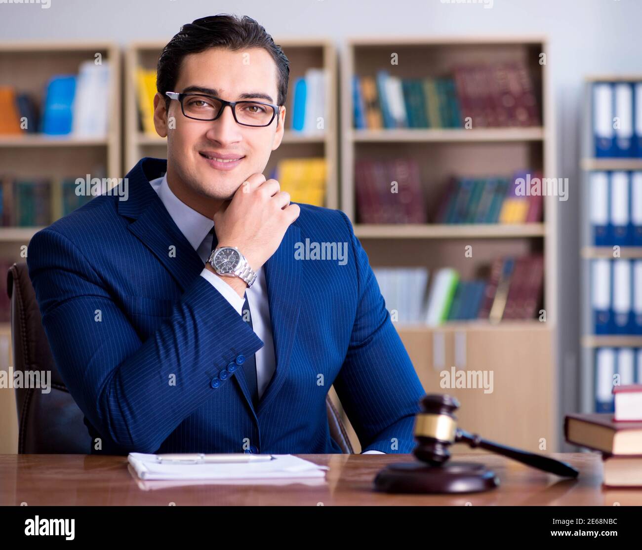 The handsome judge with gavel sitting in courtroom Stock Photo - Alamy