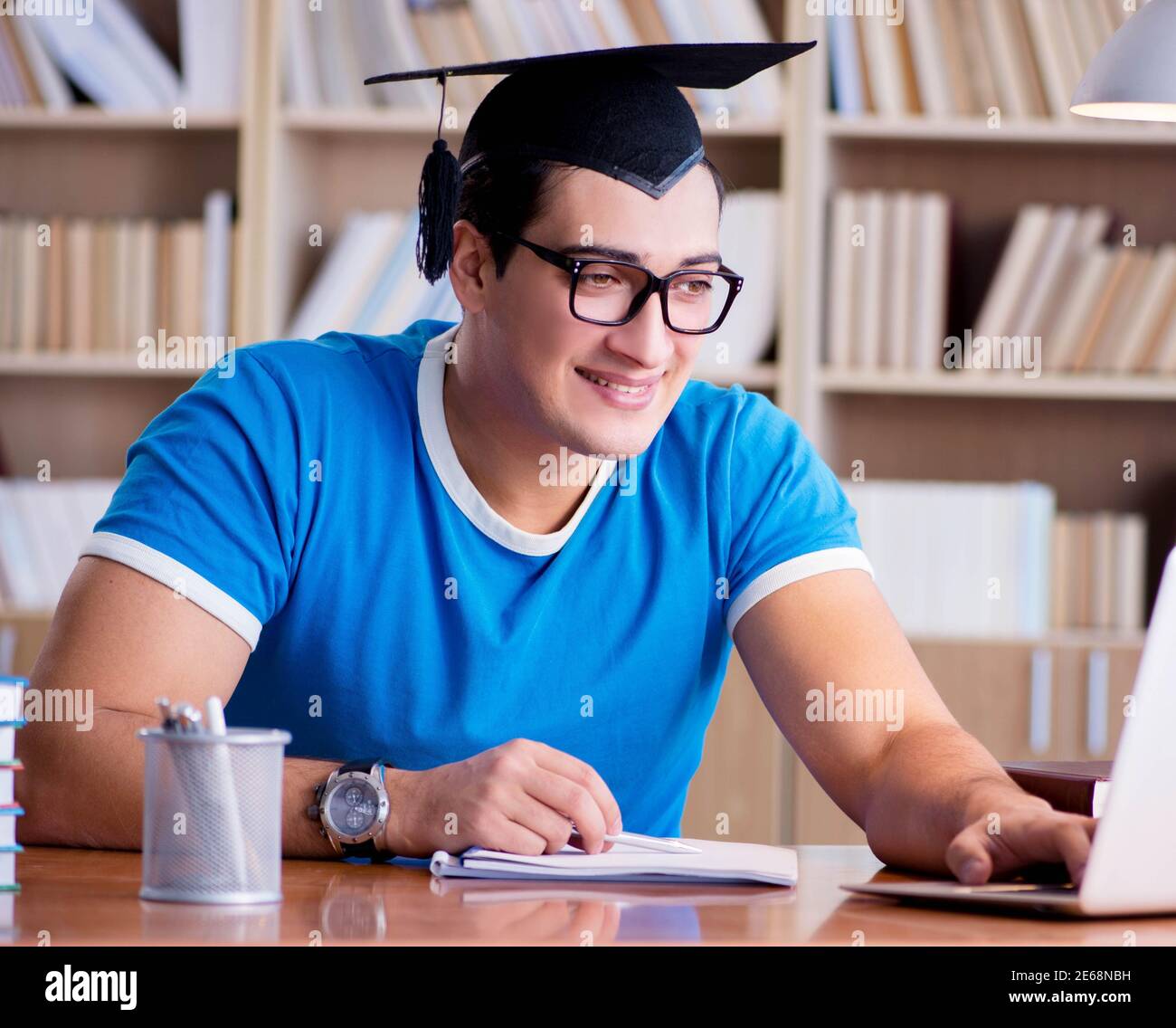 The young man graduating from university Stock Photo - Alamy