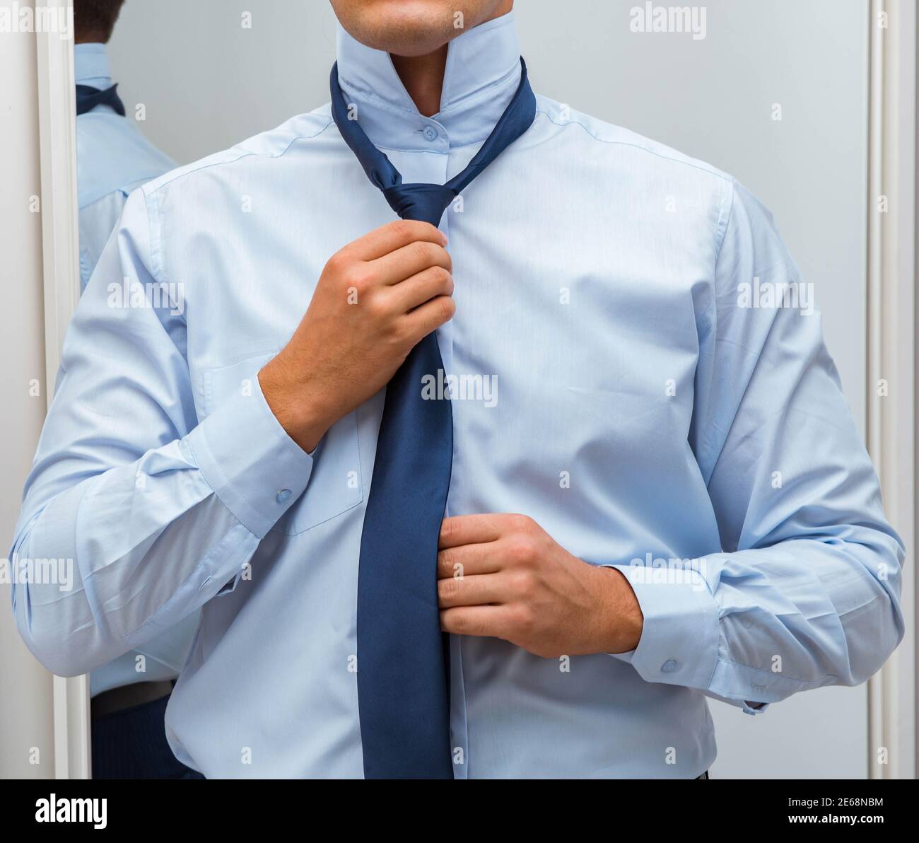 The businessman dressing up for work Stock Photo - Alamy