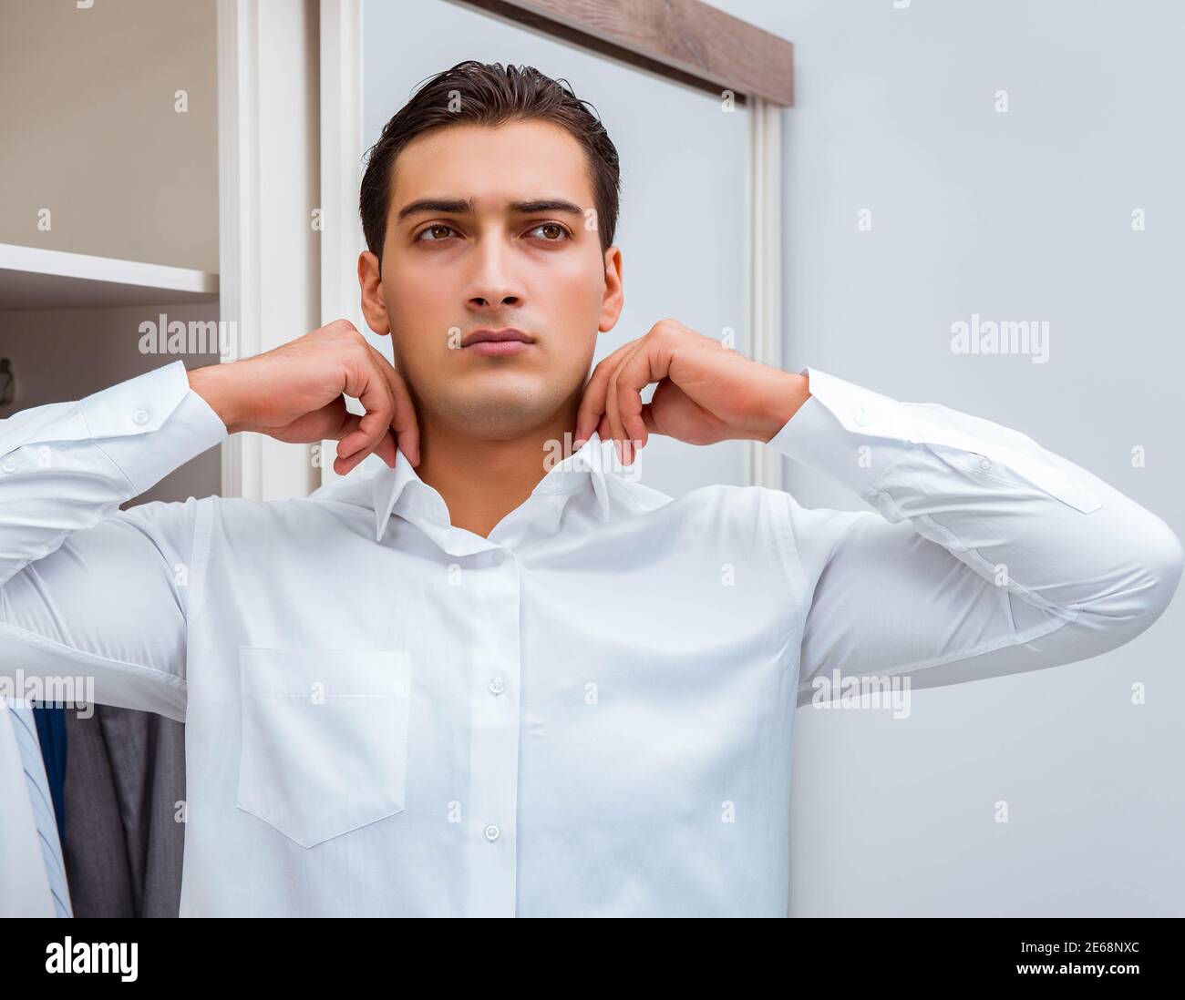 The businessman dressing up for work Stock Photo - Alamy