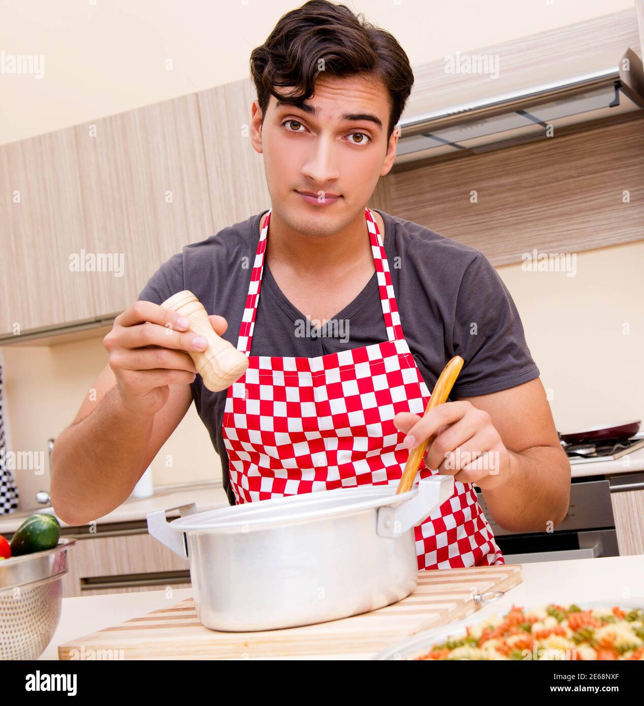 The man male cook preparing food in kitchen Stock Photo - Alamy