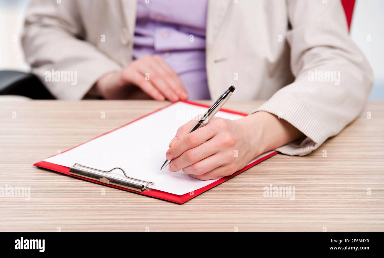 The hands taking notes in the pad Stock Photo - Alamy