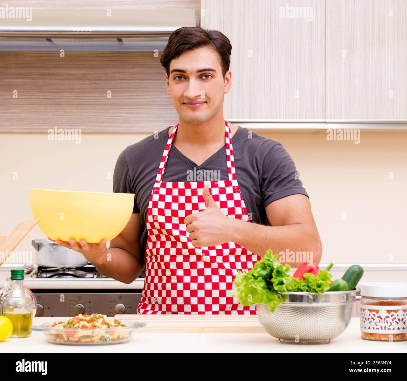 The man male cook preparing food in kitchen Stock Photo - Alamy